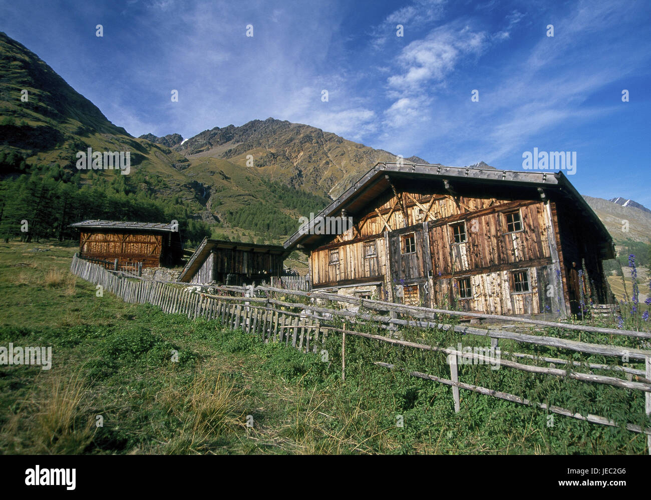 Alp with wooden hut and mountains hi-res stock photography and images ...