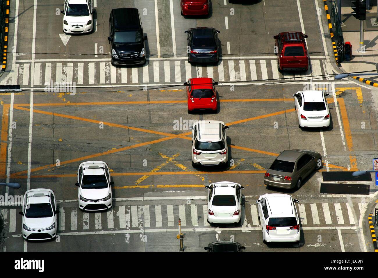 Photo of private and public vehicles at an intersection during the rush ...