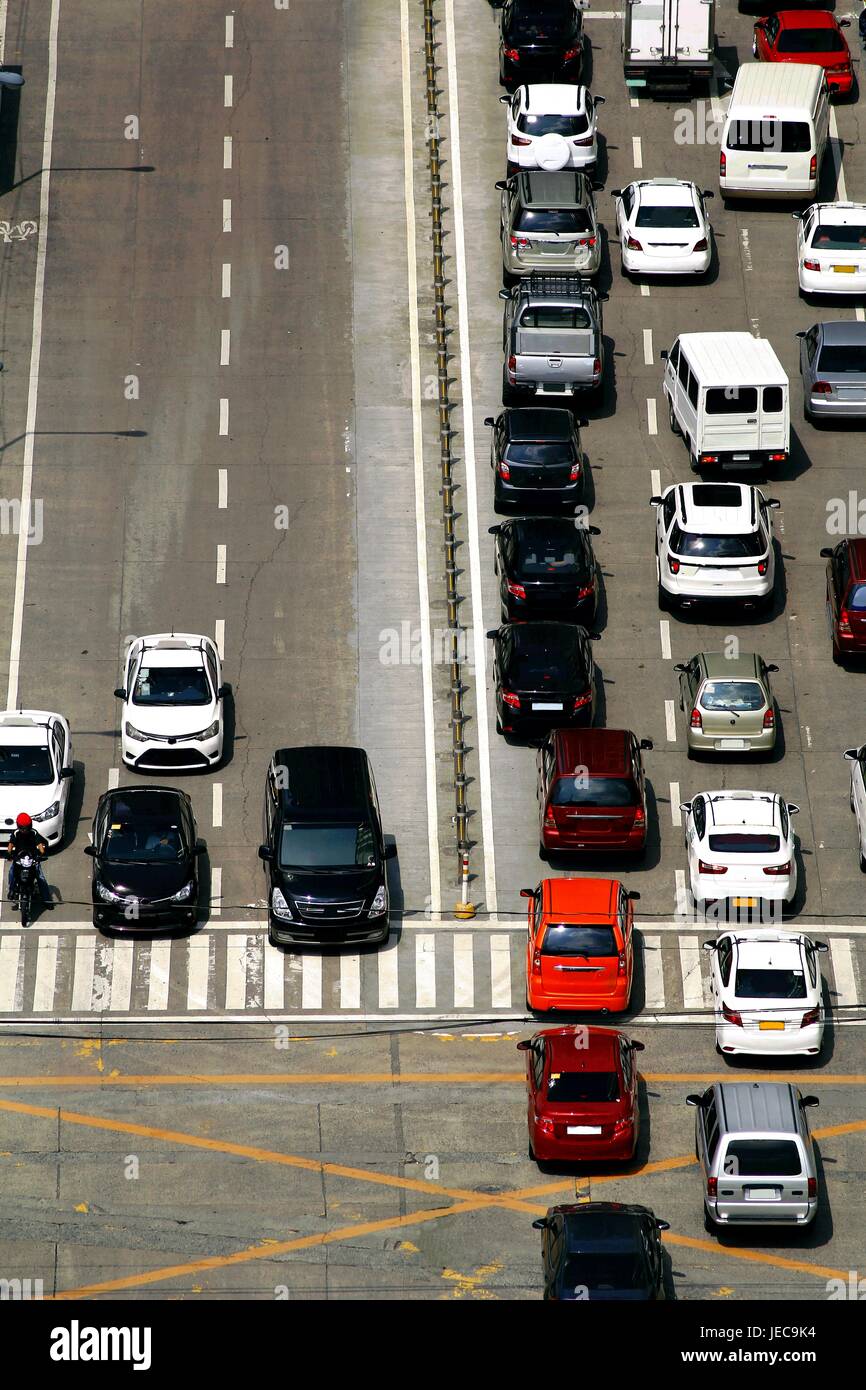 Photo of private and public vehicles at an intersection during the rush ...