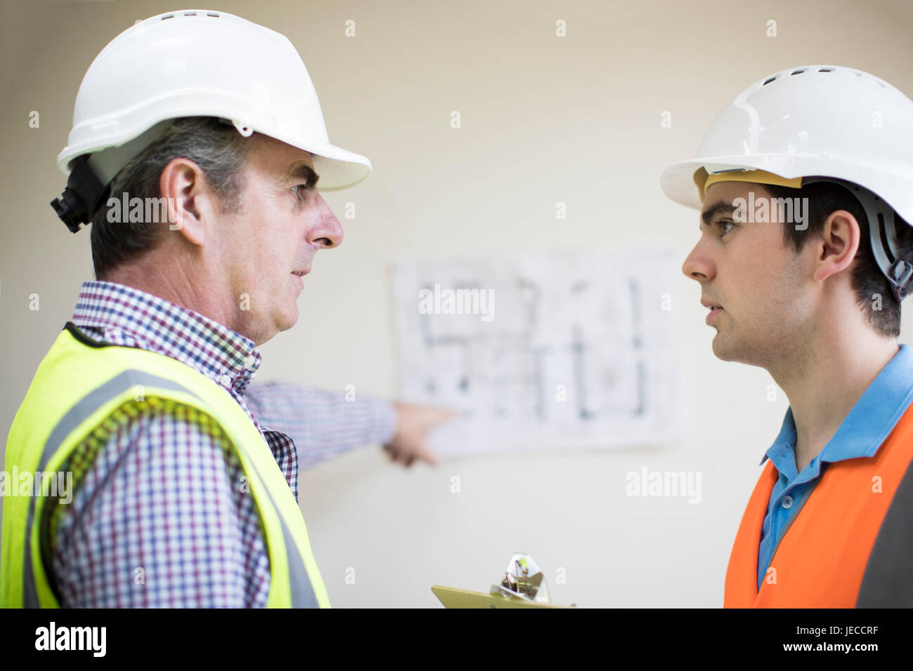Builder man plans hi-res stock photography and images - Alamy