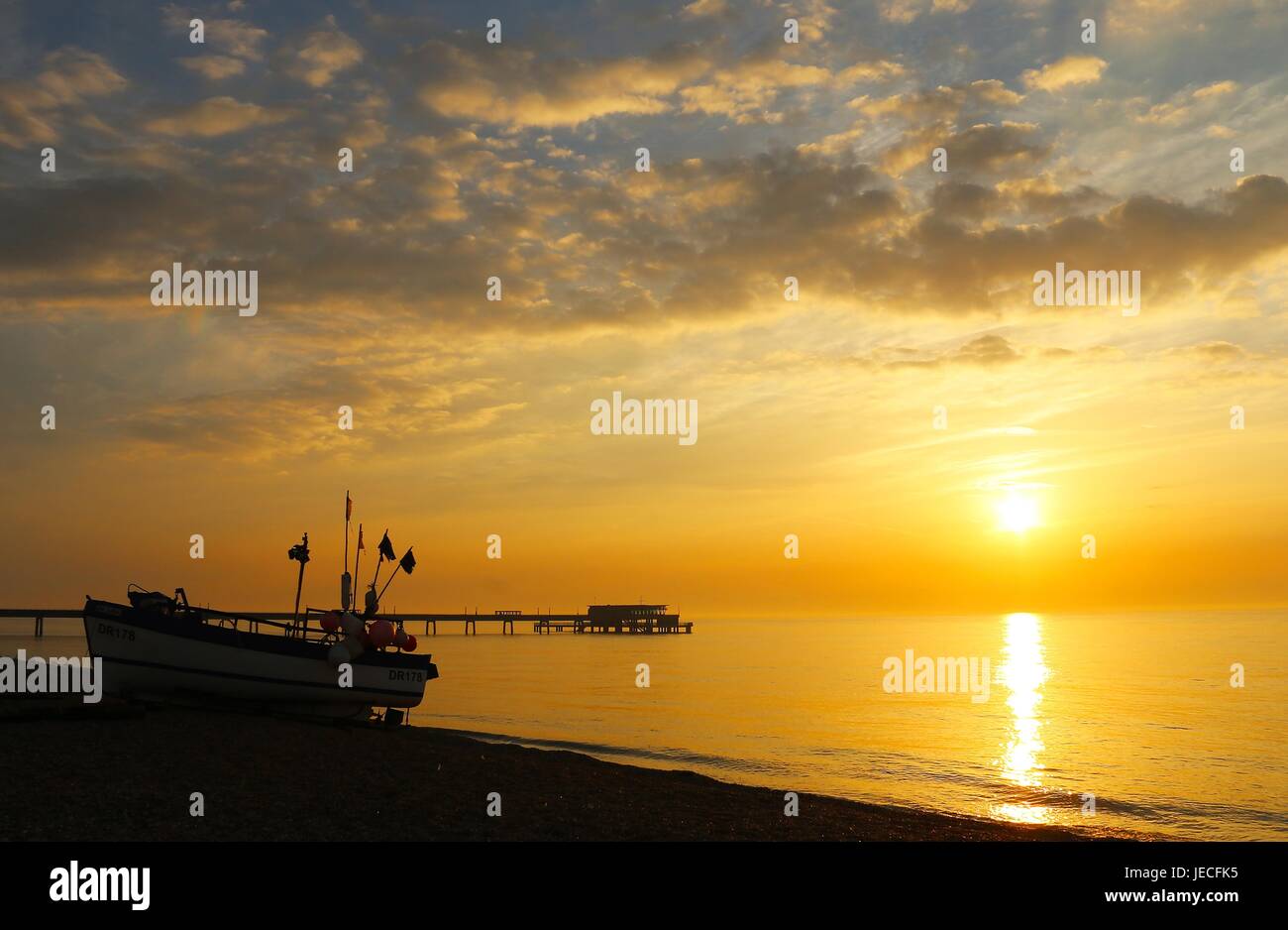 Pier and Boat at Kent coast sunrise Stock Photo - Alamy