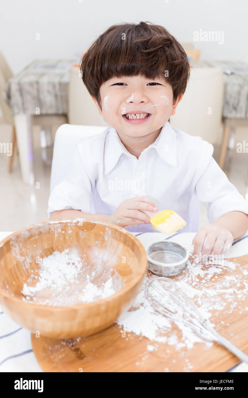 Asian Chinese little boy prepare for baking cookies at home Stock Photo ...