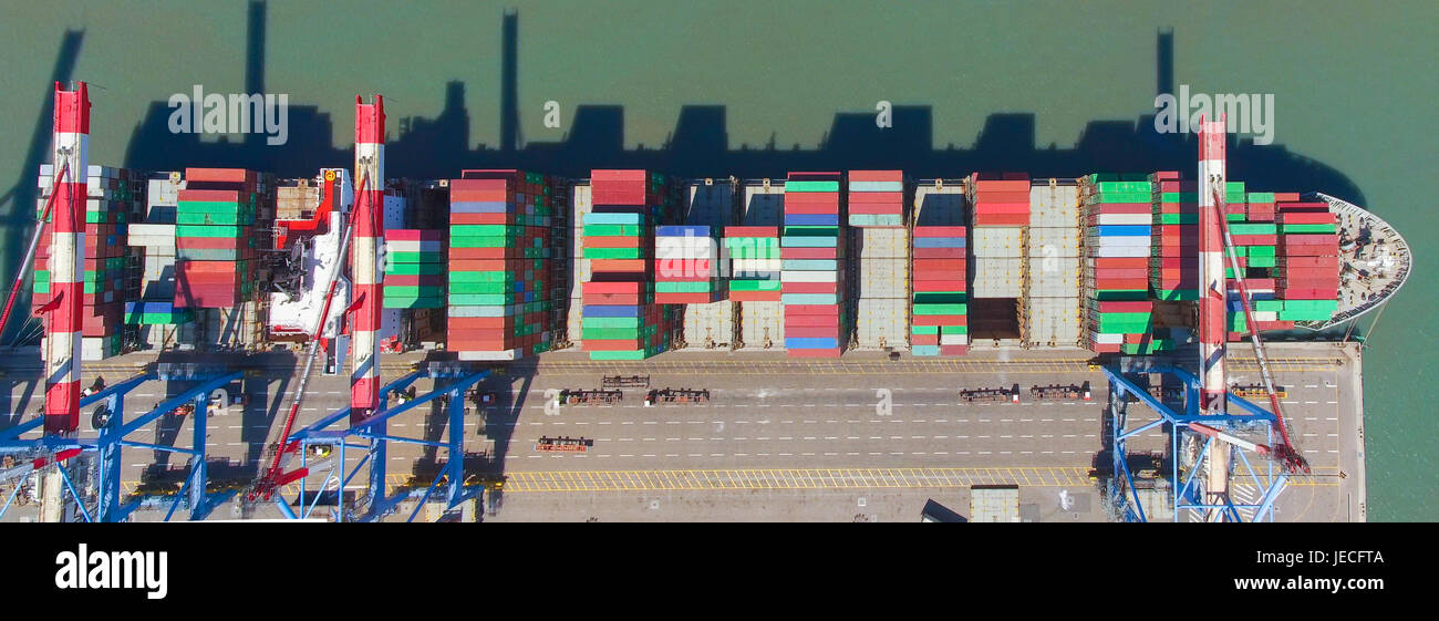 Commercial port with container ship - Top down aerial view Stock Photo ...