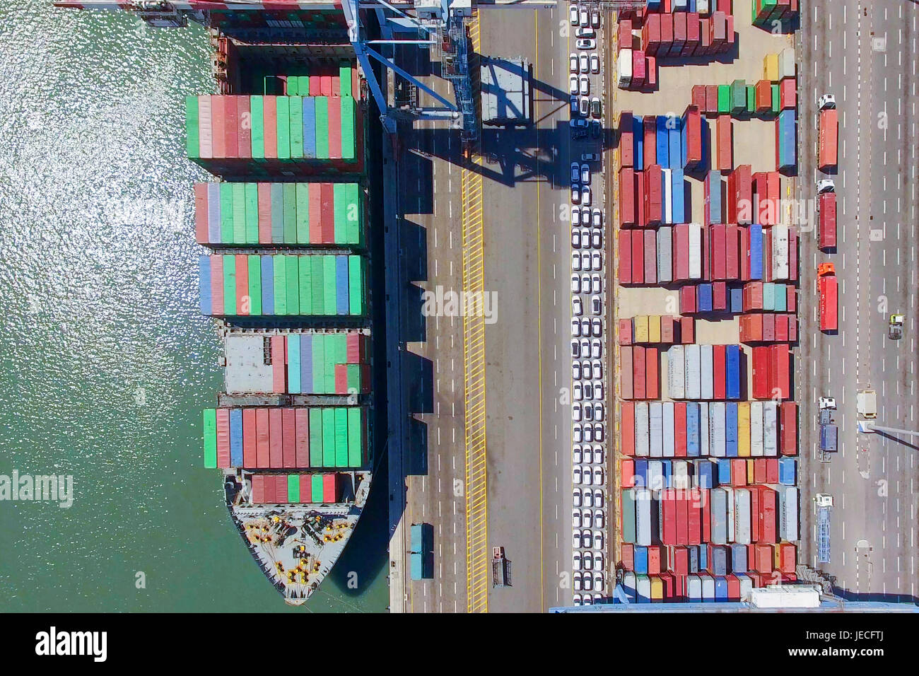 Commercial port with container ship - Top down aerial view Stock Photo ...