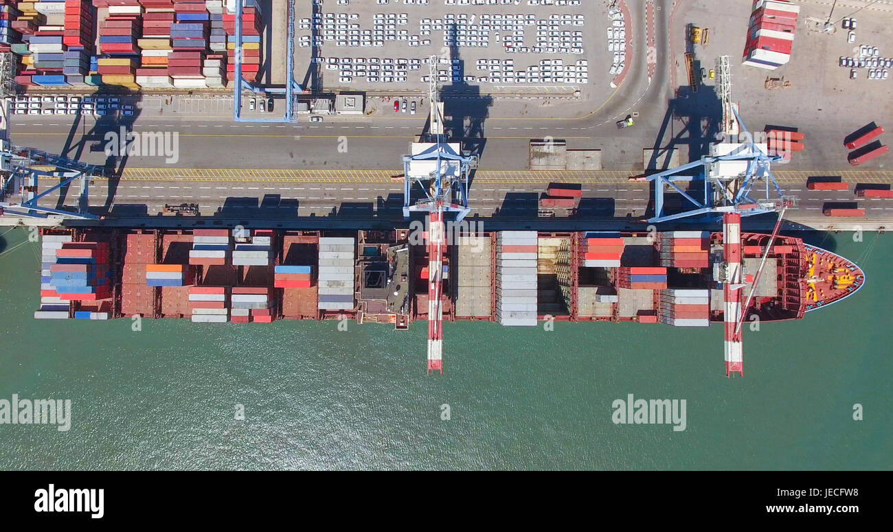 Commercial port with container ship - Top down aerial view Stock Photo ...