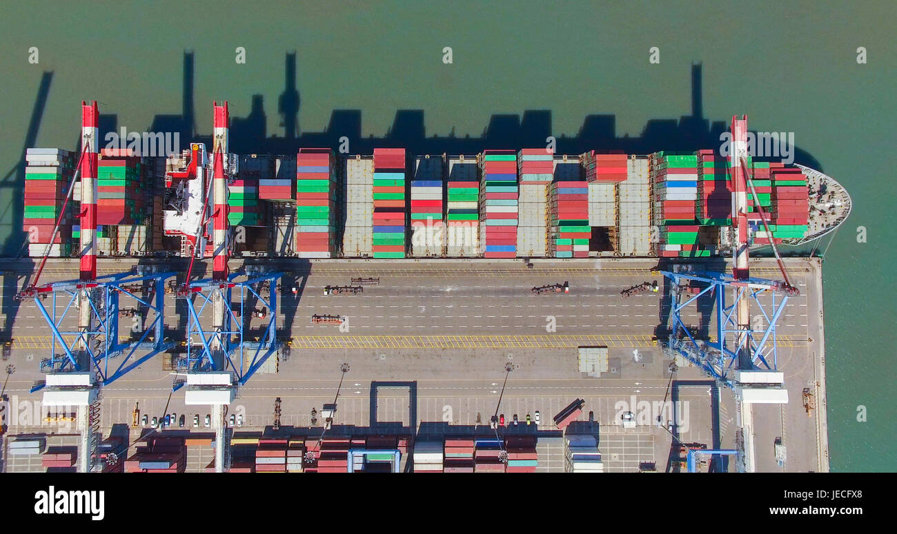 Commercial port with container ship - Top down aerial view Stock Photo ...