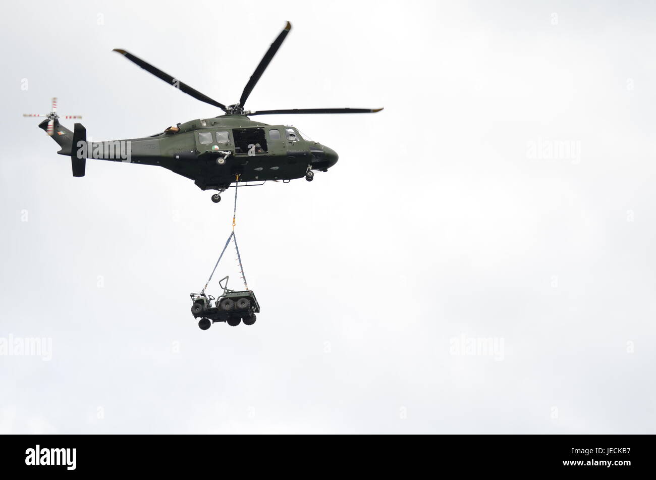 Green Military Helicopter Carrying a Jeep Stock Photo - Alamy
