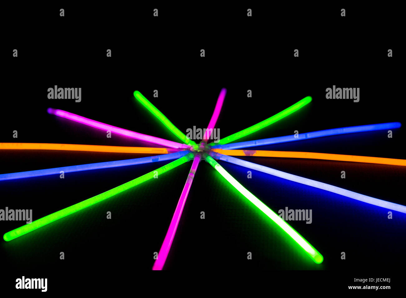 Glow sticks neon light fluorescent on back background. variation of ...