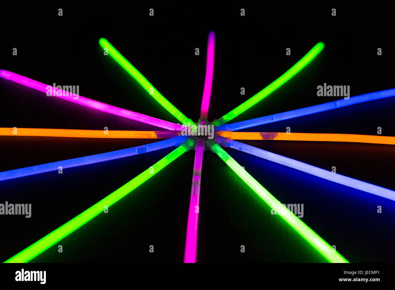 Glow sticks neon light fluorescent on back background. variation of ...