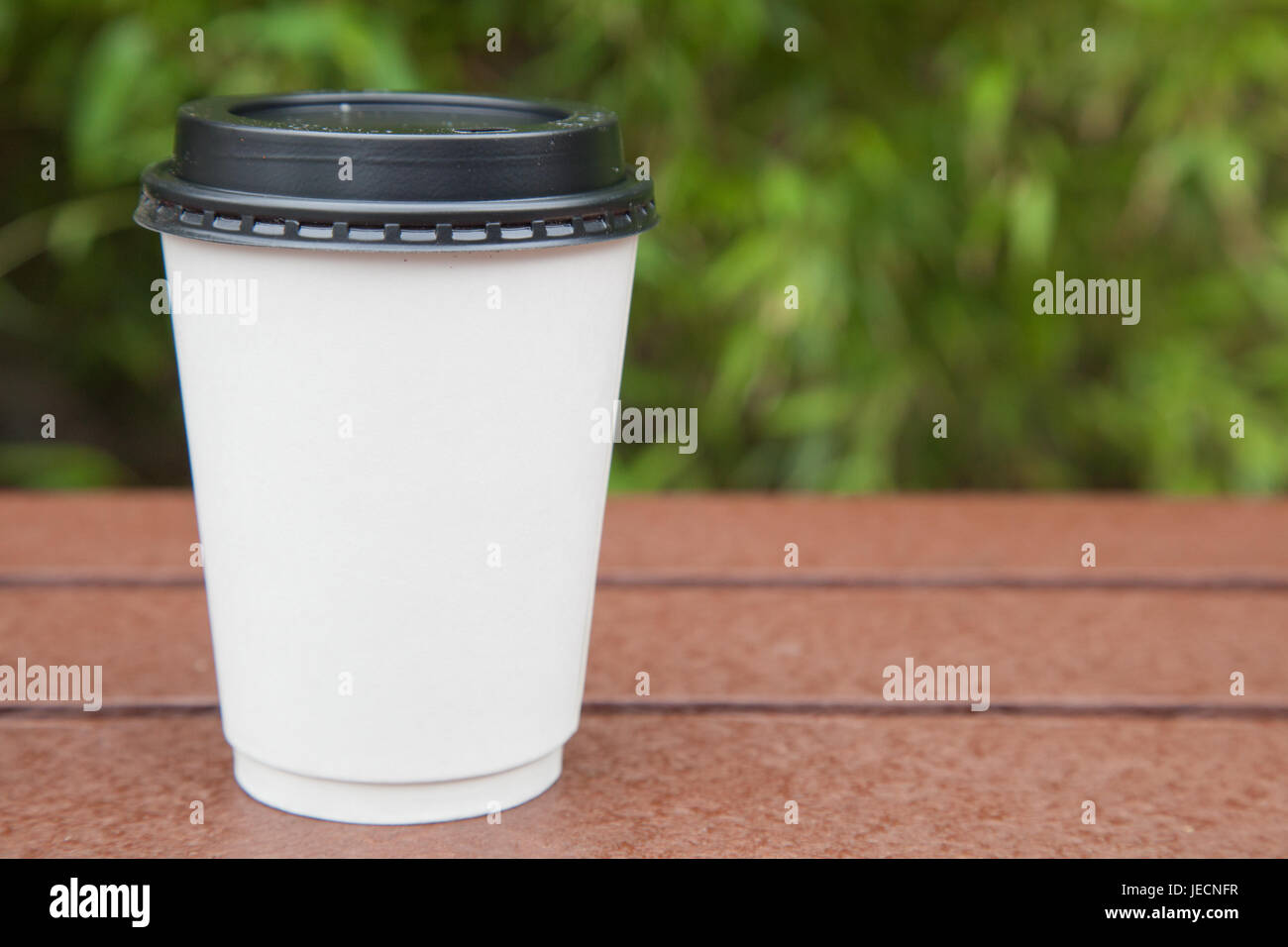 White take away cup with no logo on a table outdoors Stock Photo - Alamy