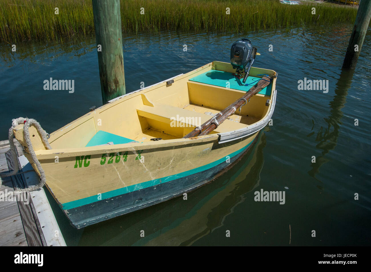 Small yellow rowboat in Beaufort, North Carolina Stock Photo - Alamy