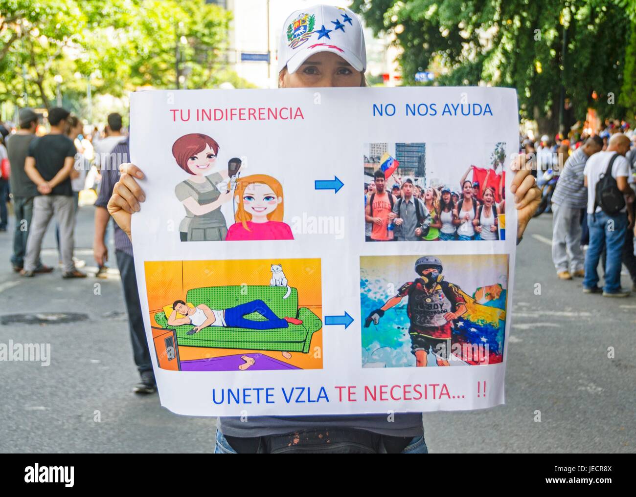 A girl carries a poster with drawings that says: Your indifference does ...