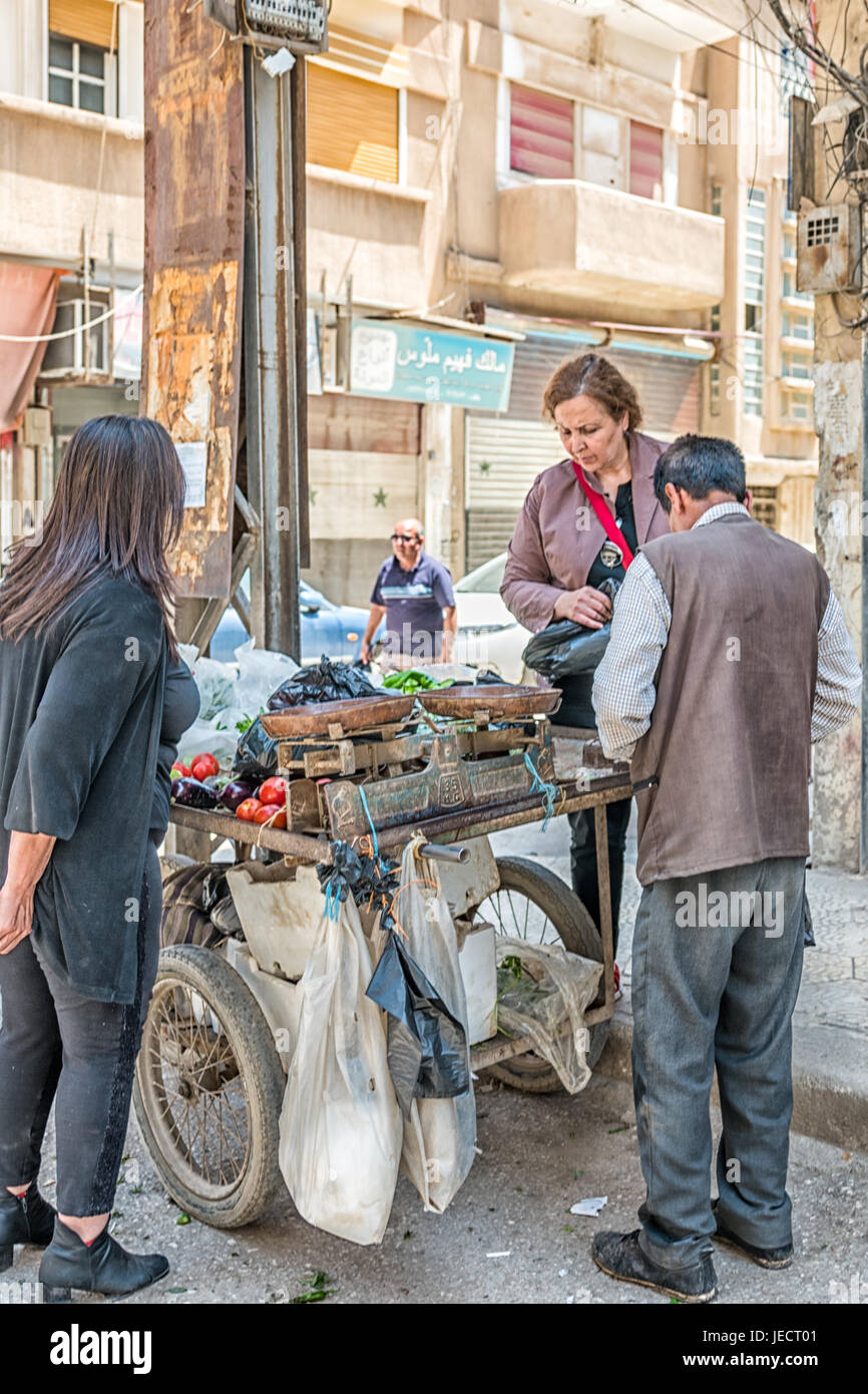 People buying vegetables from a street vendor in Hasakah, Syria Stock ...