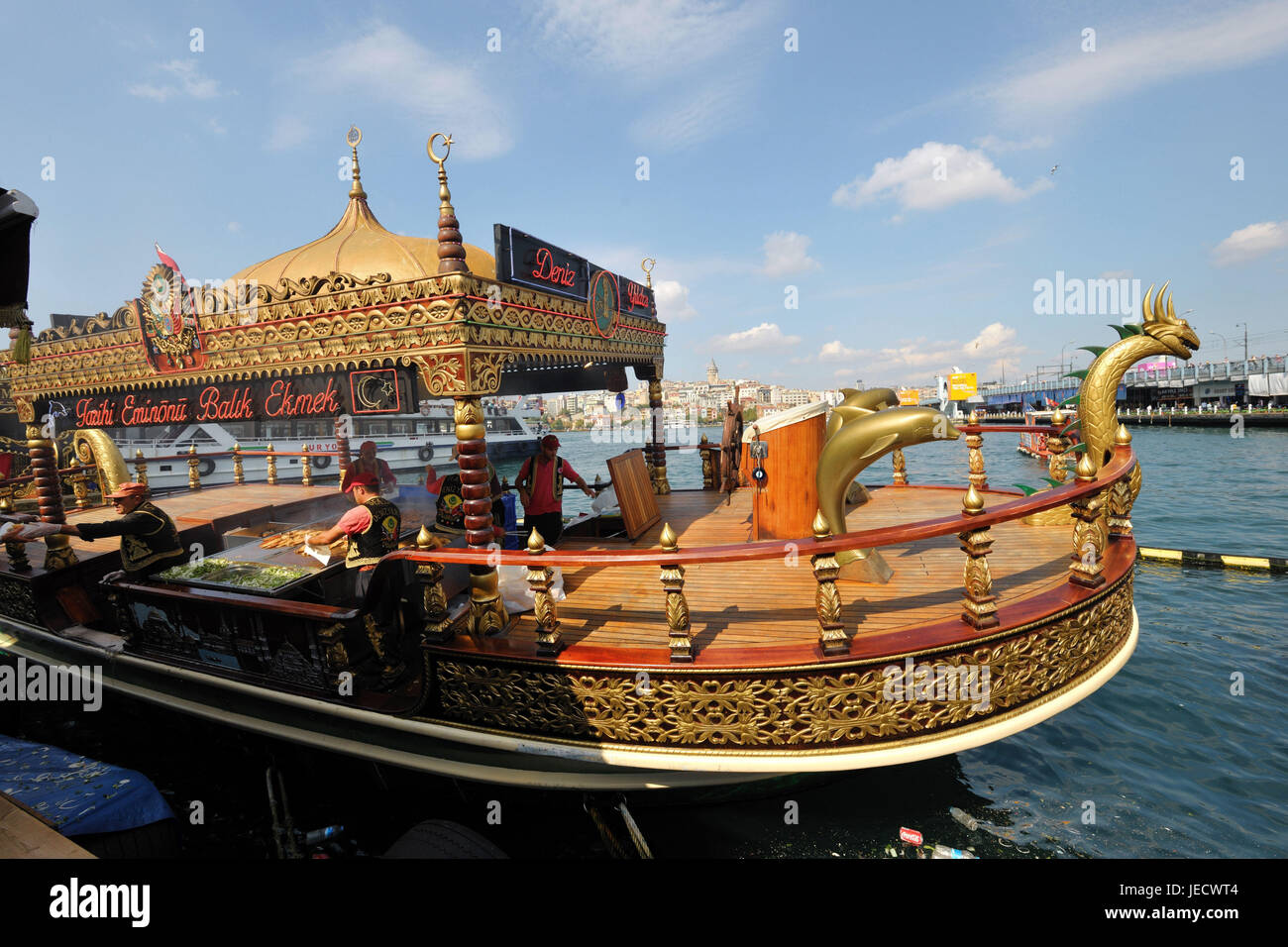 Turkey, Istanbul, fish restaurant on a ship, seller of fish sandwiches ...