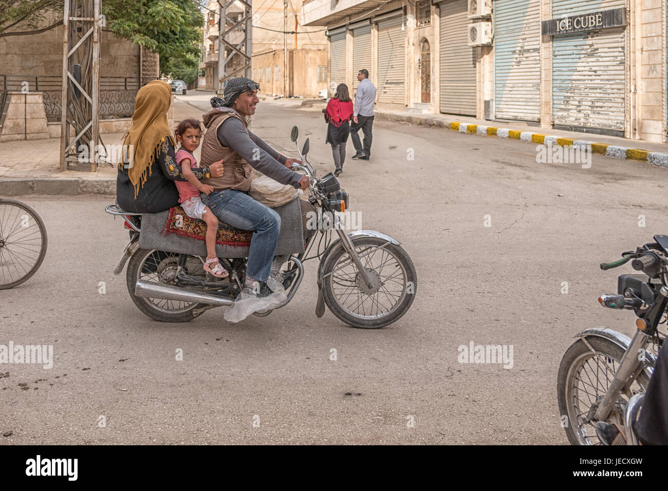 Young family on their motorbike in Hasakah, Syria Stock Photo - Alamy