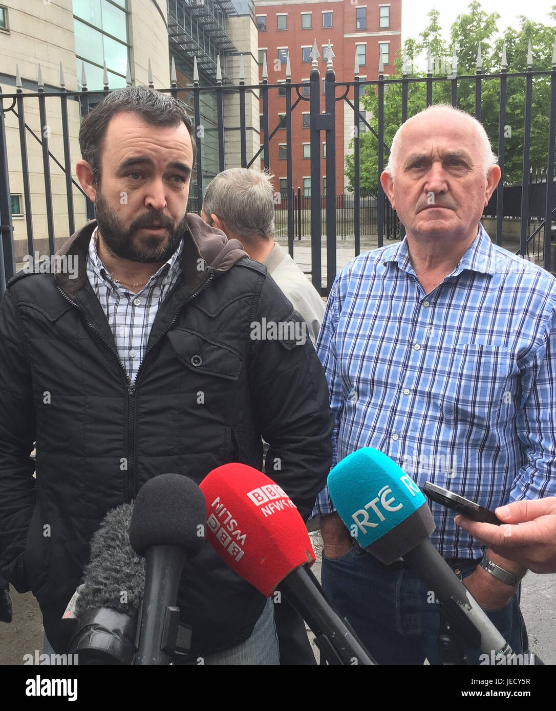 Eamon Fox's son Ciaran (left) and Gary Convie's father Joe outside ...