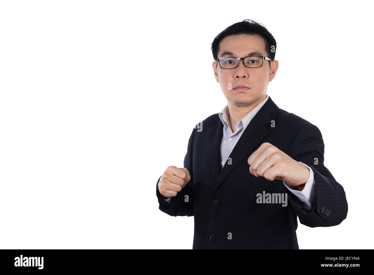 Angry Asian Chinese man wearing suit and holding both fist in isolated ...