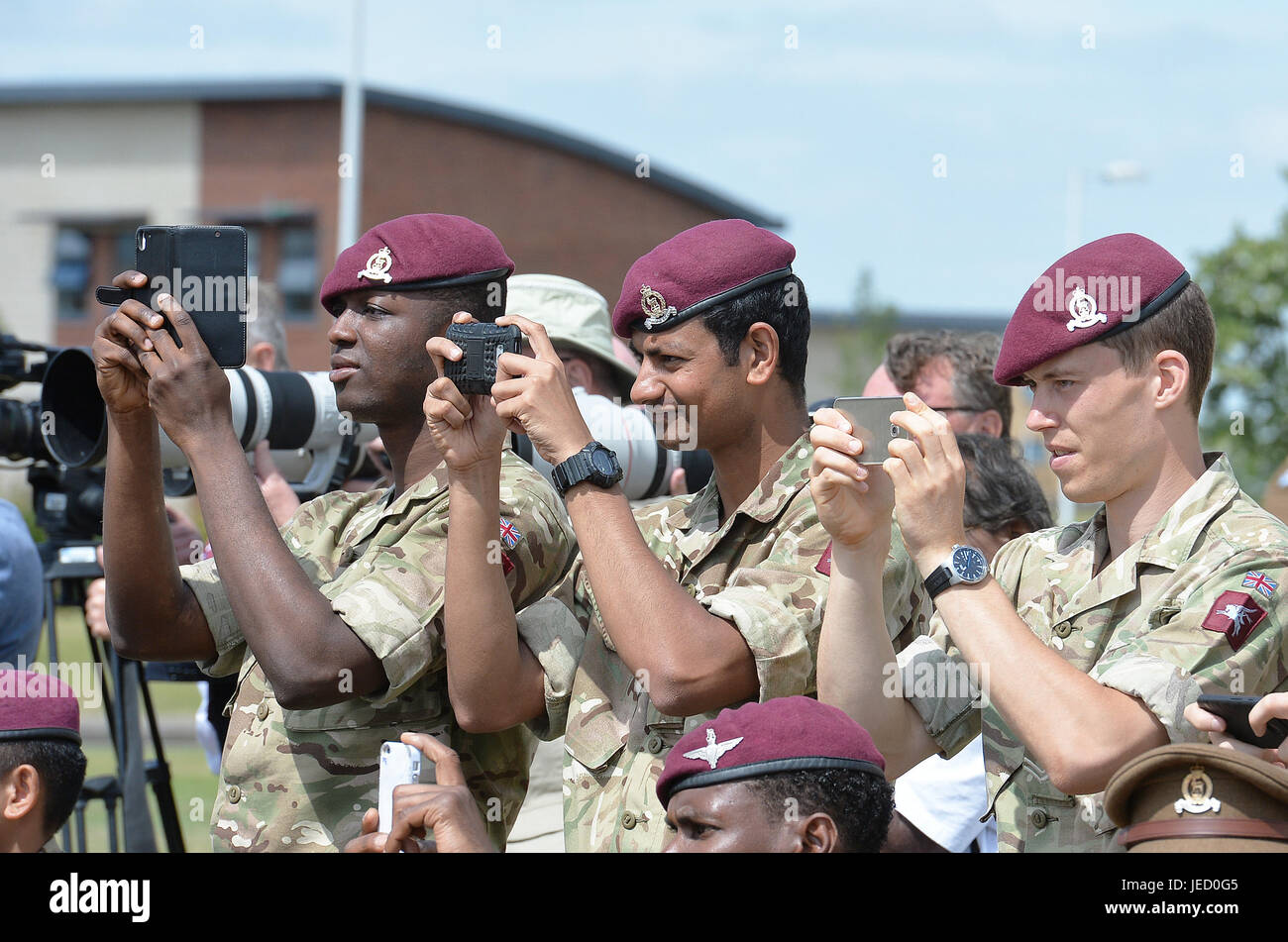 The Prince of Wales is in focus from members of the Para Regiment ...