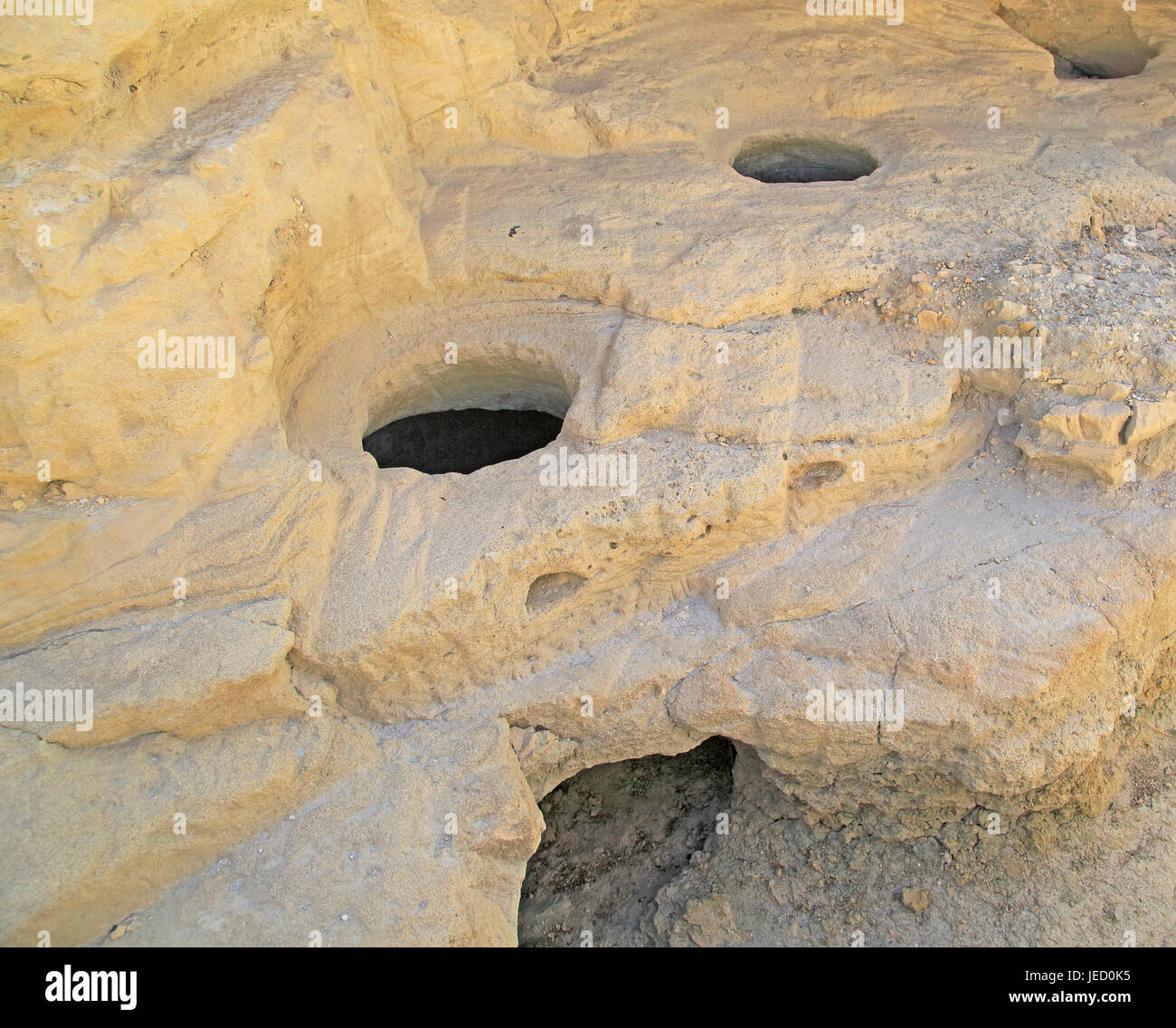 Prehistoric storage pits in limestone rock at the base of the Citadel ...