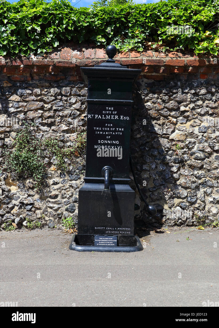 A tall cast iron hand operated village water supply pump in the heart ...