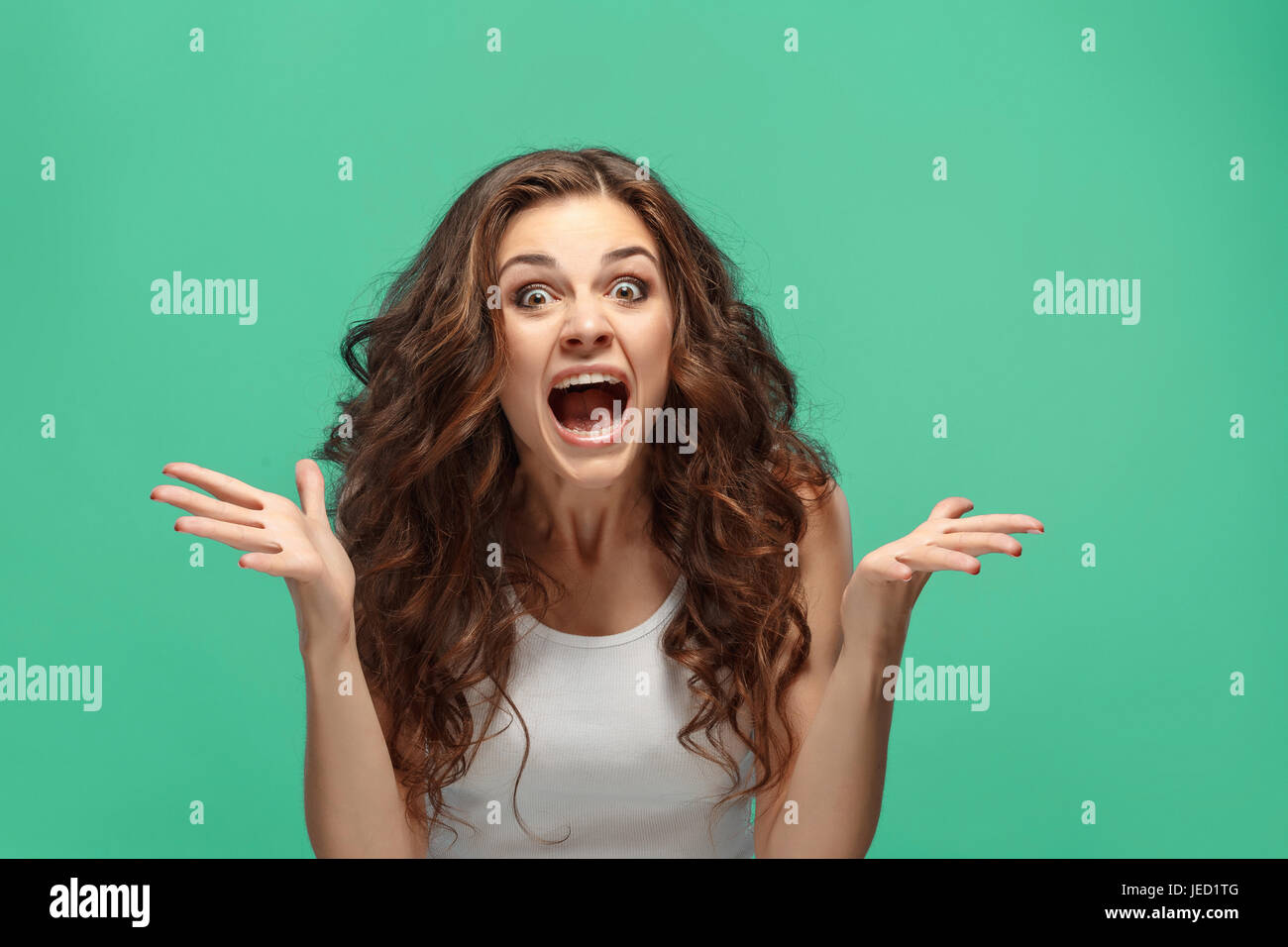 Portrait of young woman with shocked facial expression Stock Photo - Alamy