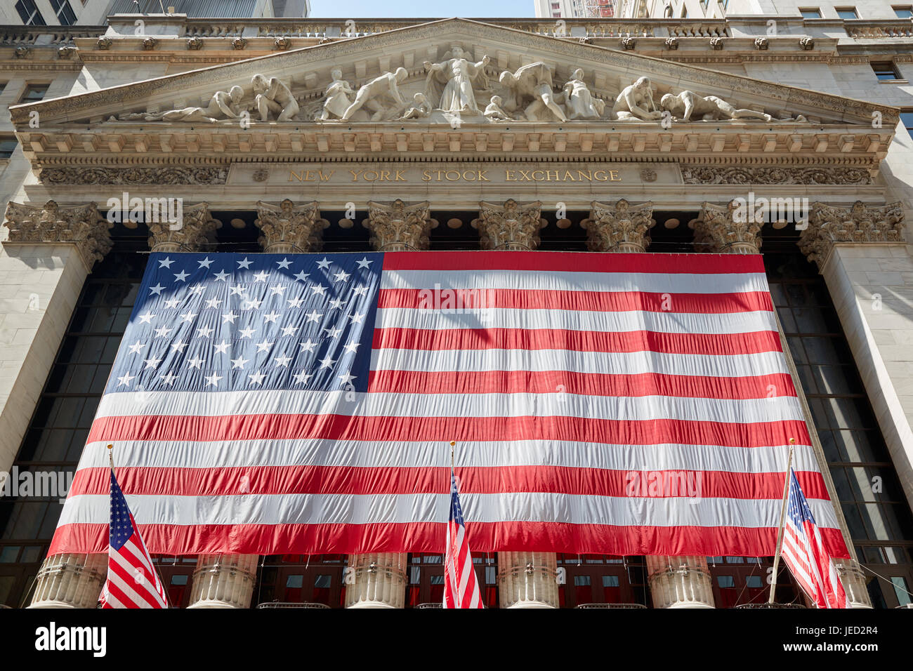 Wall Street Stock Exchange building with big US flag, financial ...