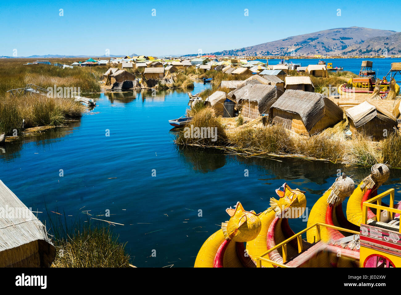 View of Uros floating islands with typical boats, Puno, Peru Stock ...