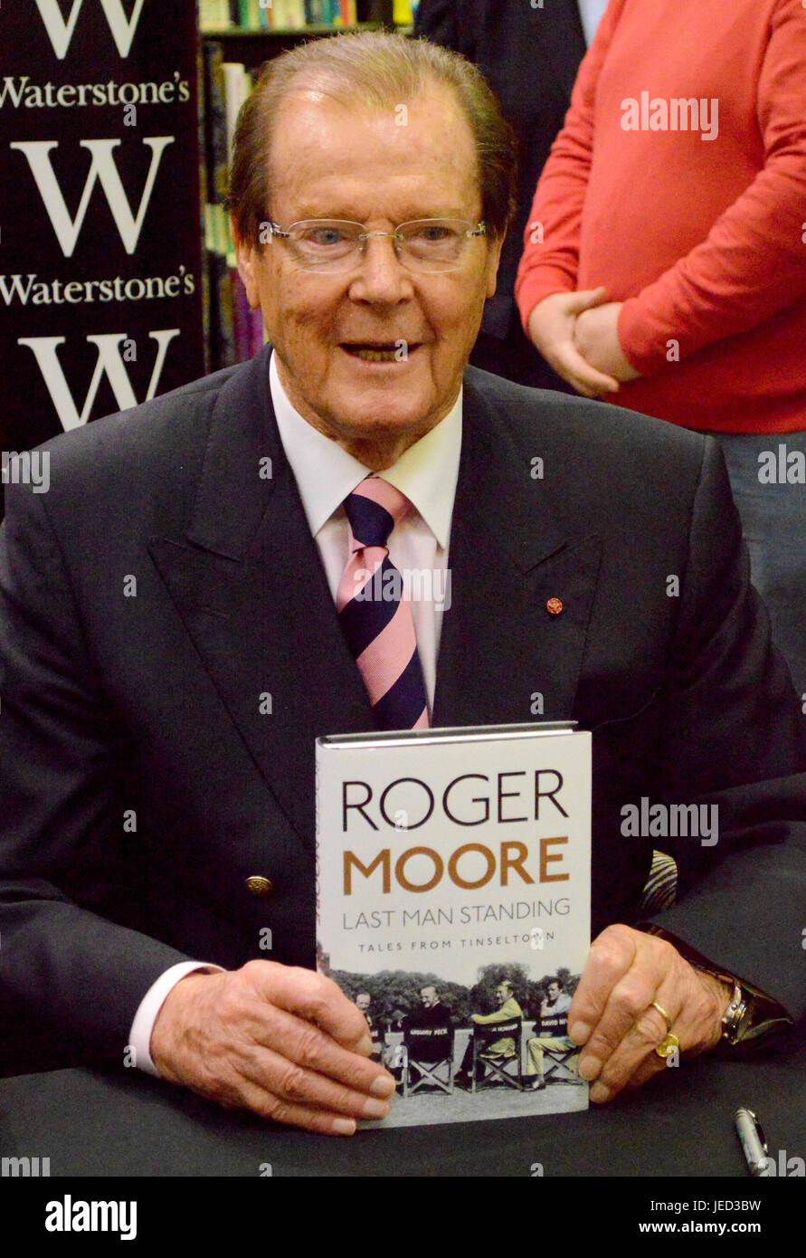 Sir Roger Moore signing copies of his autobiography 'Last Man Standing ...