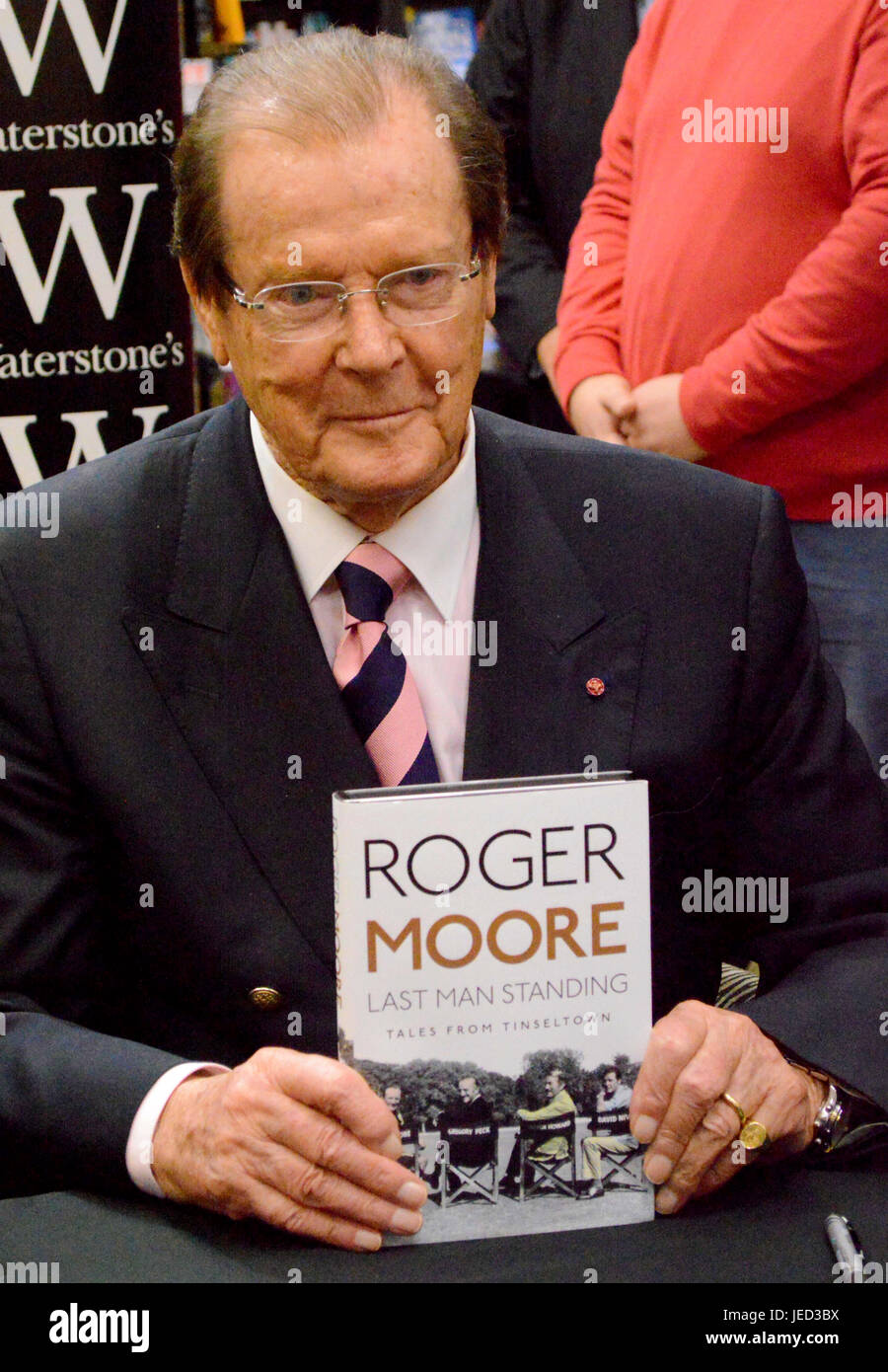 Sir Roger Moore signing copies of his autobiography 'Last Man Standing ...