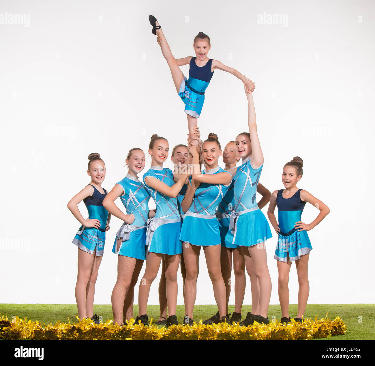 The group of teen cheerleaders posing at white studio Stock Photo - Alamy