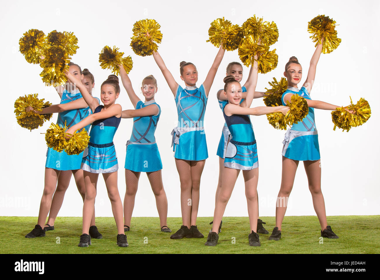 The group of teen cheerleaders posing at white studio Stock Photo - Alamy