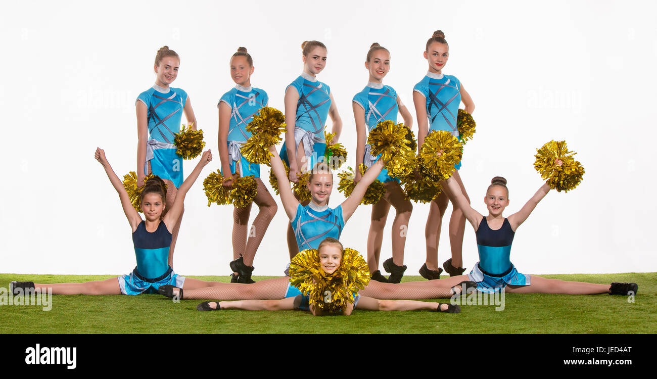 The group of teen cheerleaders posing at white studio Stock Photo - Alamy