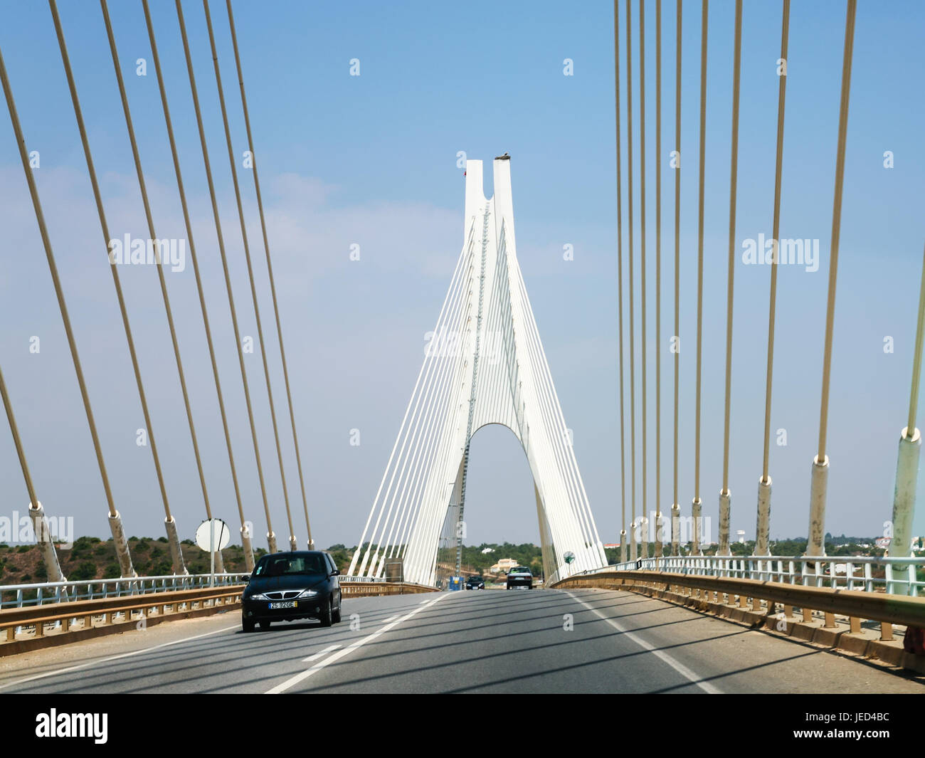 PORTIMAO, PORTUGAL - JUNE 18, 2006: cars on cable-stayed bridge over ...
