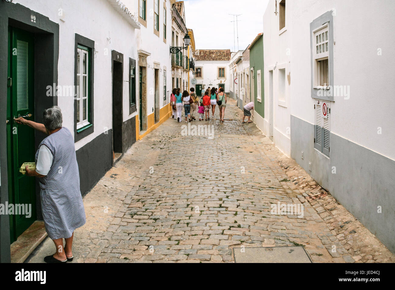 FARO, PORTUGAL - JUNE 25, 2006: people on typical street in historical ...
