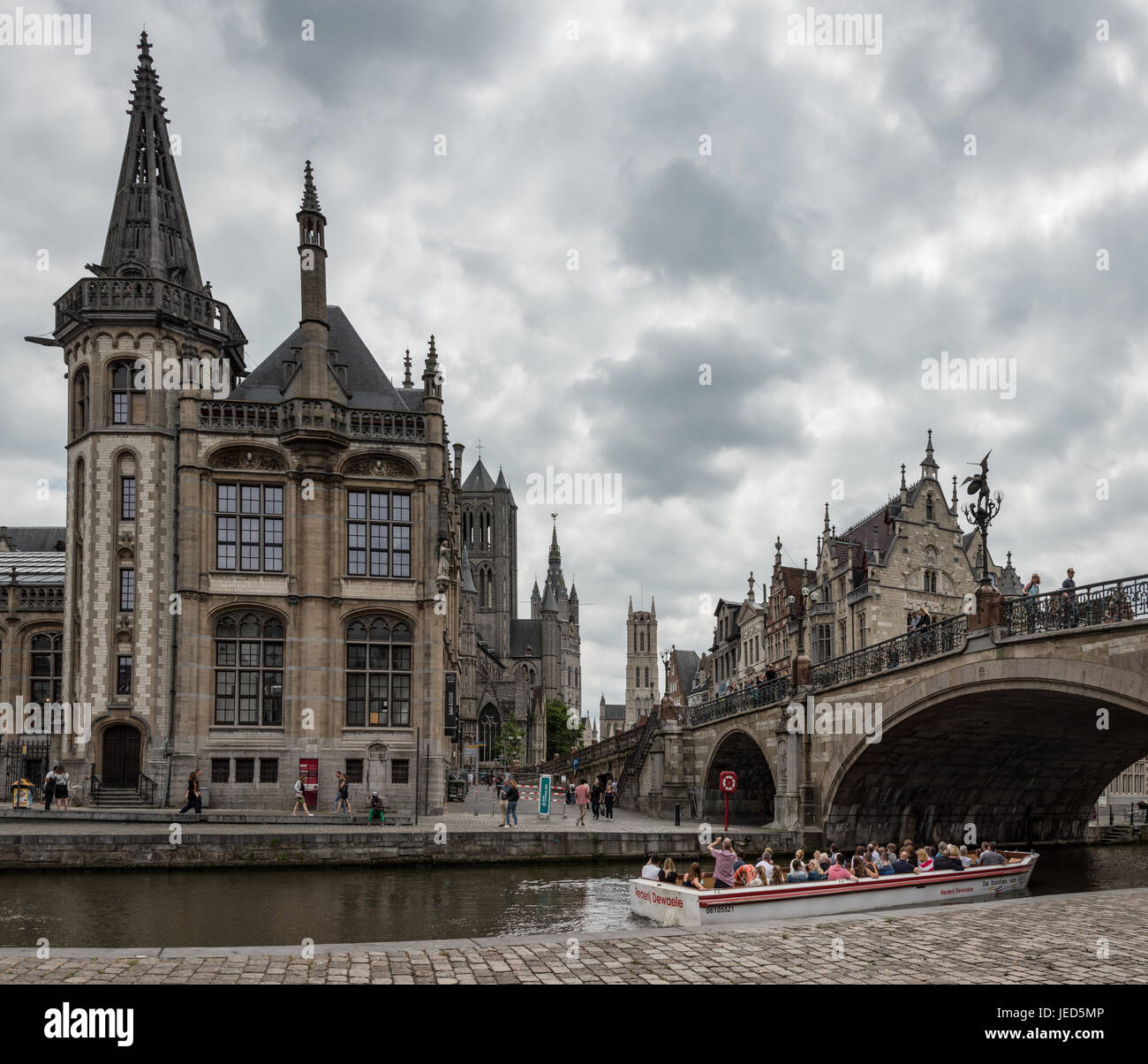 A group of tourists visits Ghent historic district in a boat Stock ...