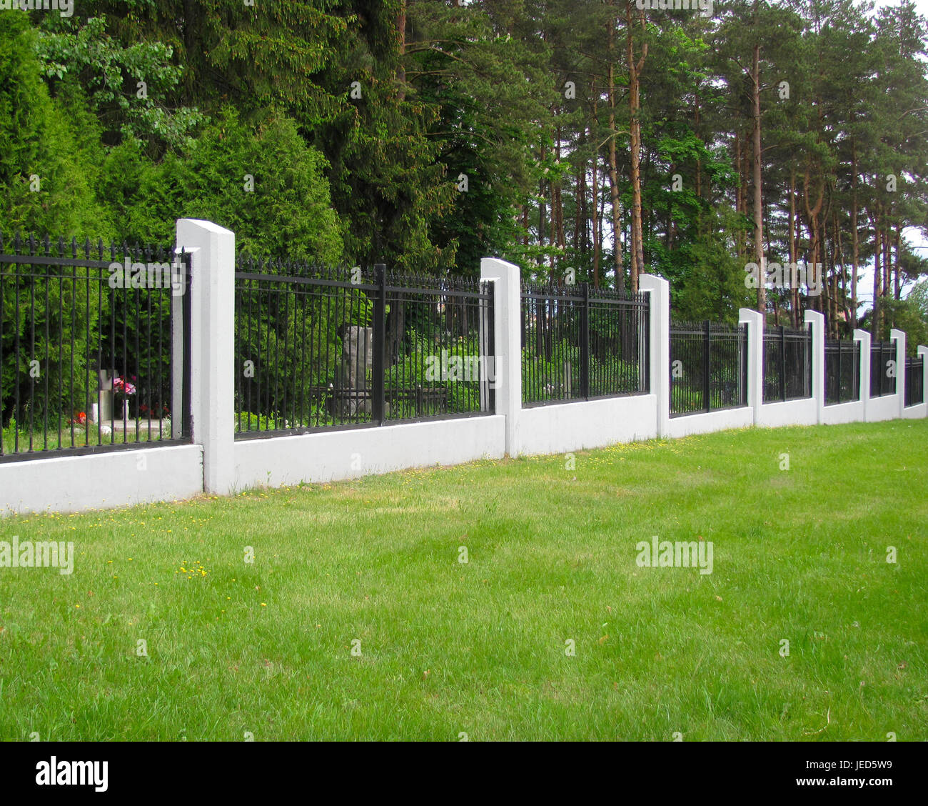 Cemetery fence, green grass Stock Photo - Alamy