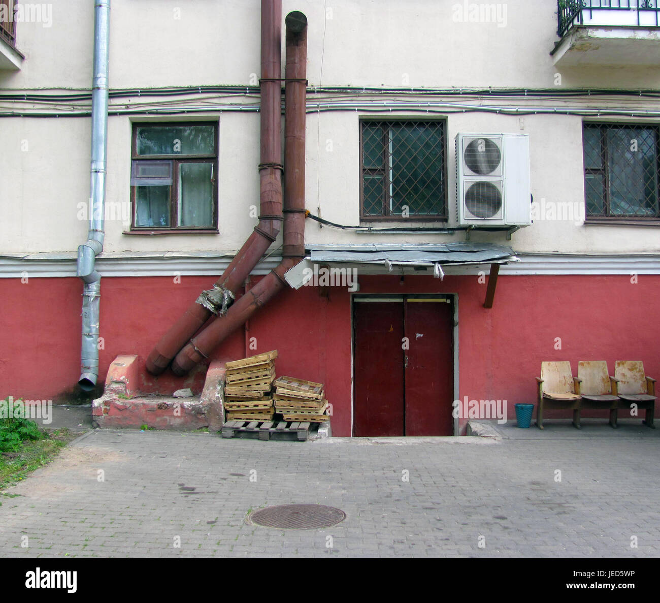 Back entrance to the shop. Pipes for ventilation, air conditioning on ...