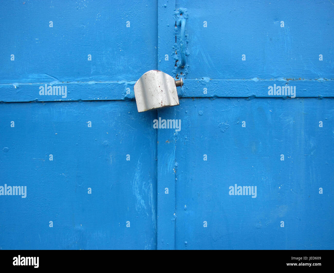 Blue metal door with lock close-up Stock Photo - Alamy