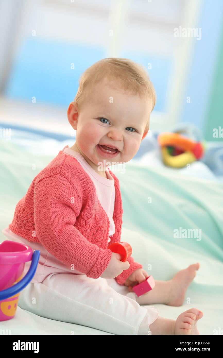 Baby, 6 months, portrait, seated Stock Photo - Alamy