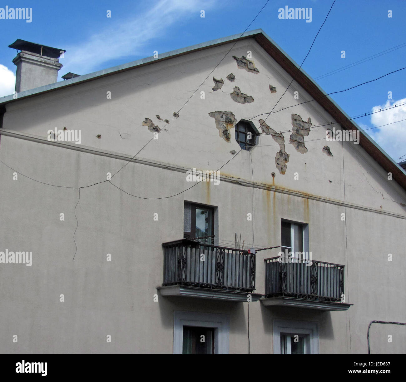 Peeling off the facade of the house, the plaster has fallen off Stock ...