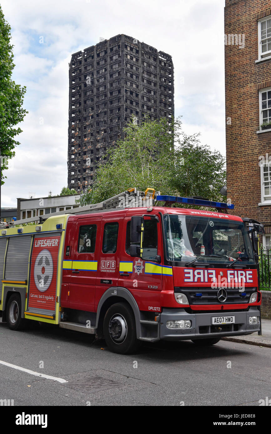 London, UK. 23rd June, 2017. A parked fire engine is seen as the burned ...