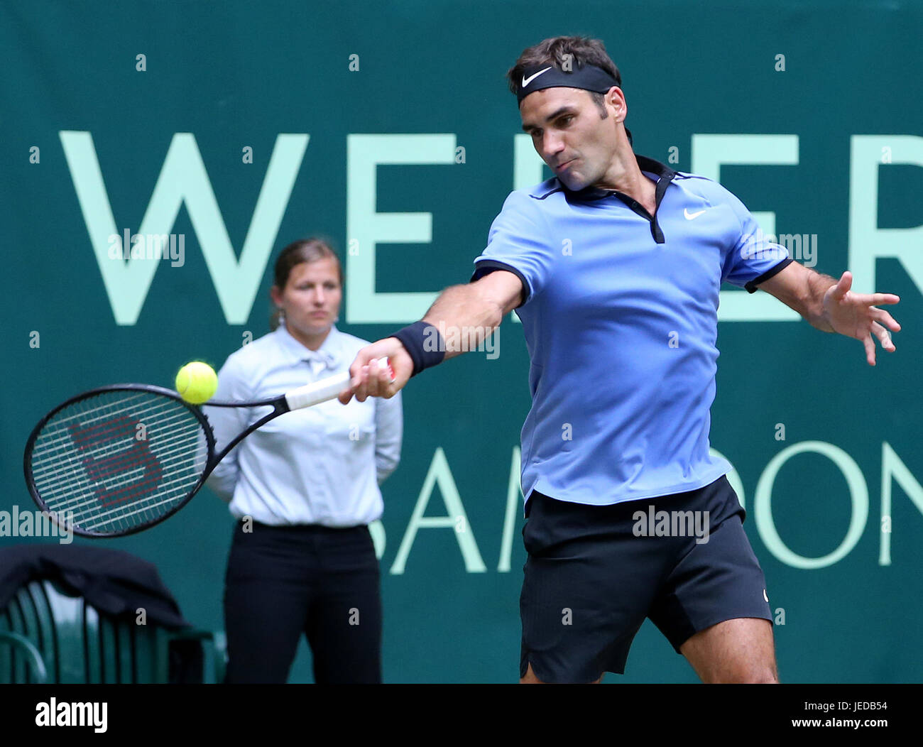 Halle, Germany. 23rd June, 2017. Roger Federer of Switzerland returns ...