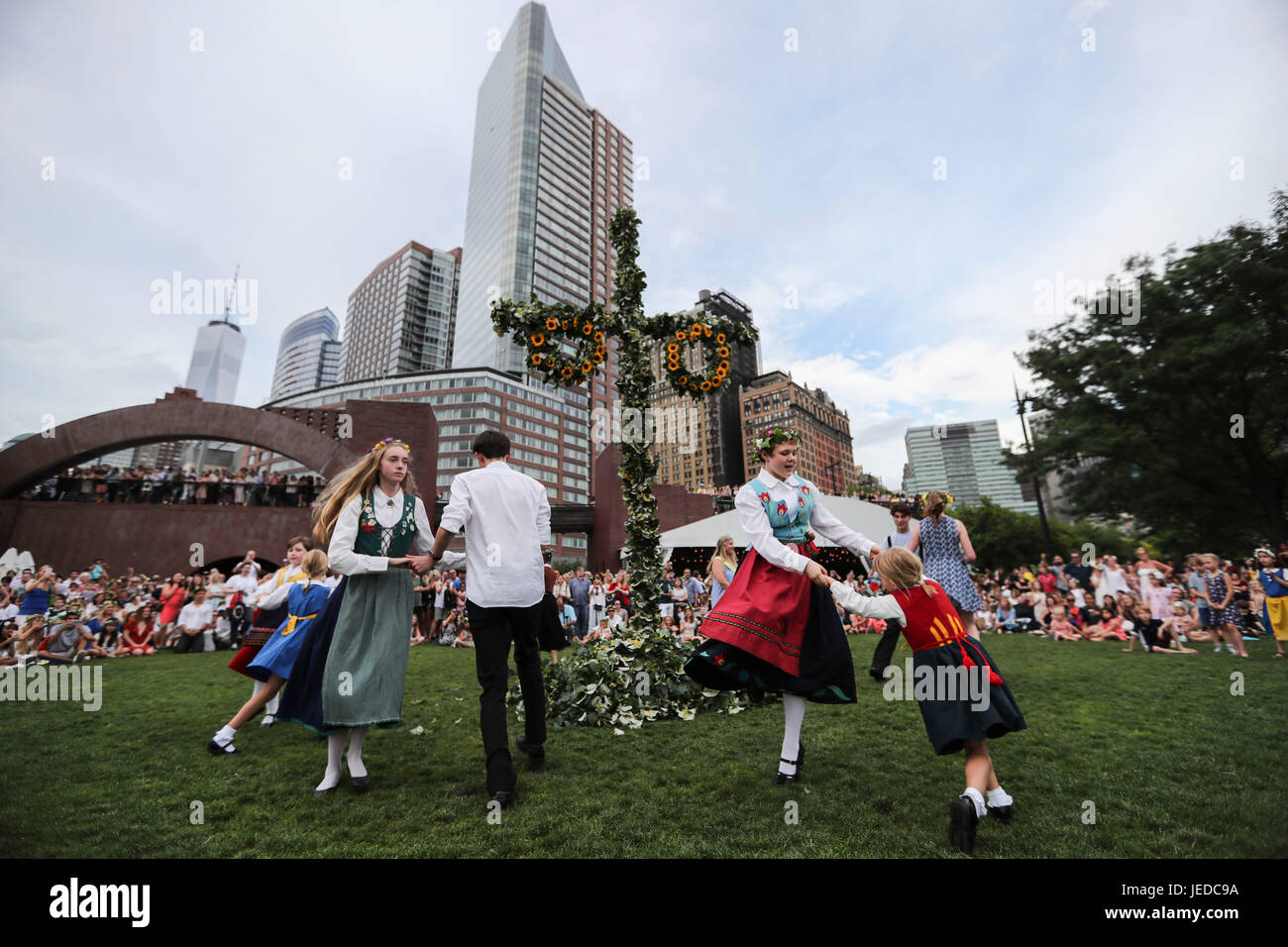 New York, New York, USA. 23rd June, 2017. People dance around a maypole ...