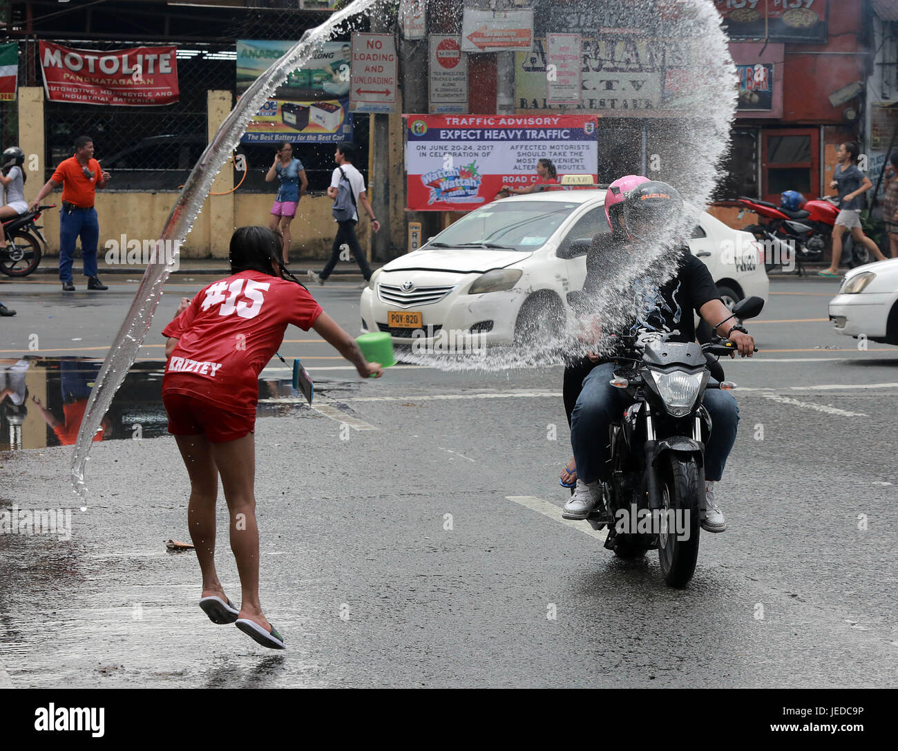 San Juan City, Philippines. 24th June, 2017. Residents splash water at ...