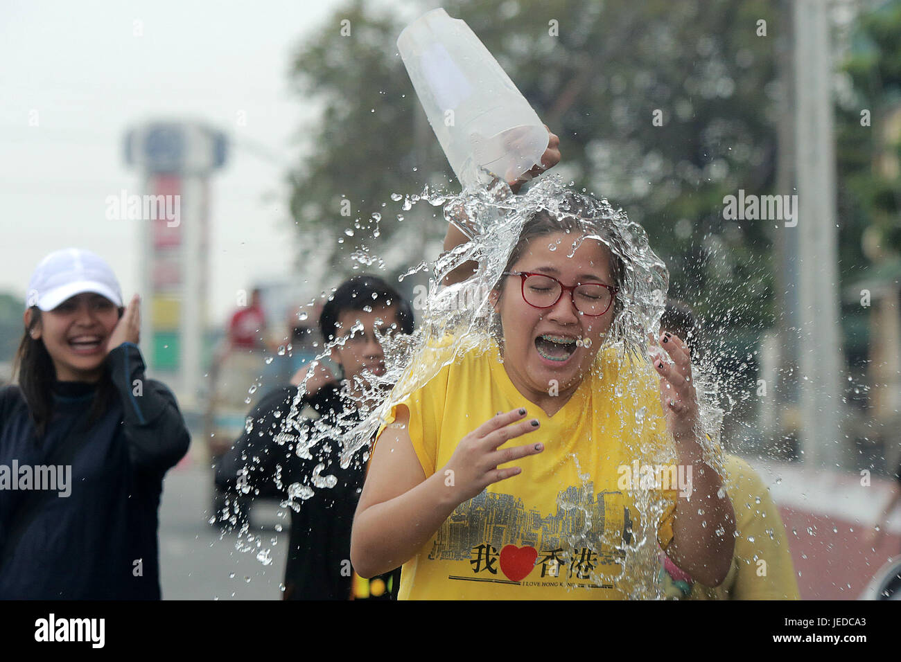 San Juan City, Philippines. 24th June, 2017. Residents splash water at ...