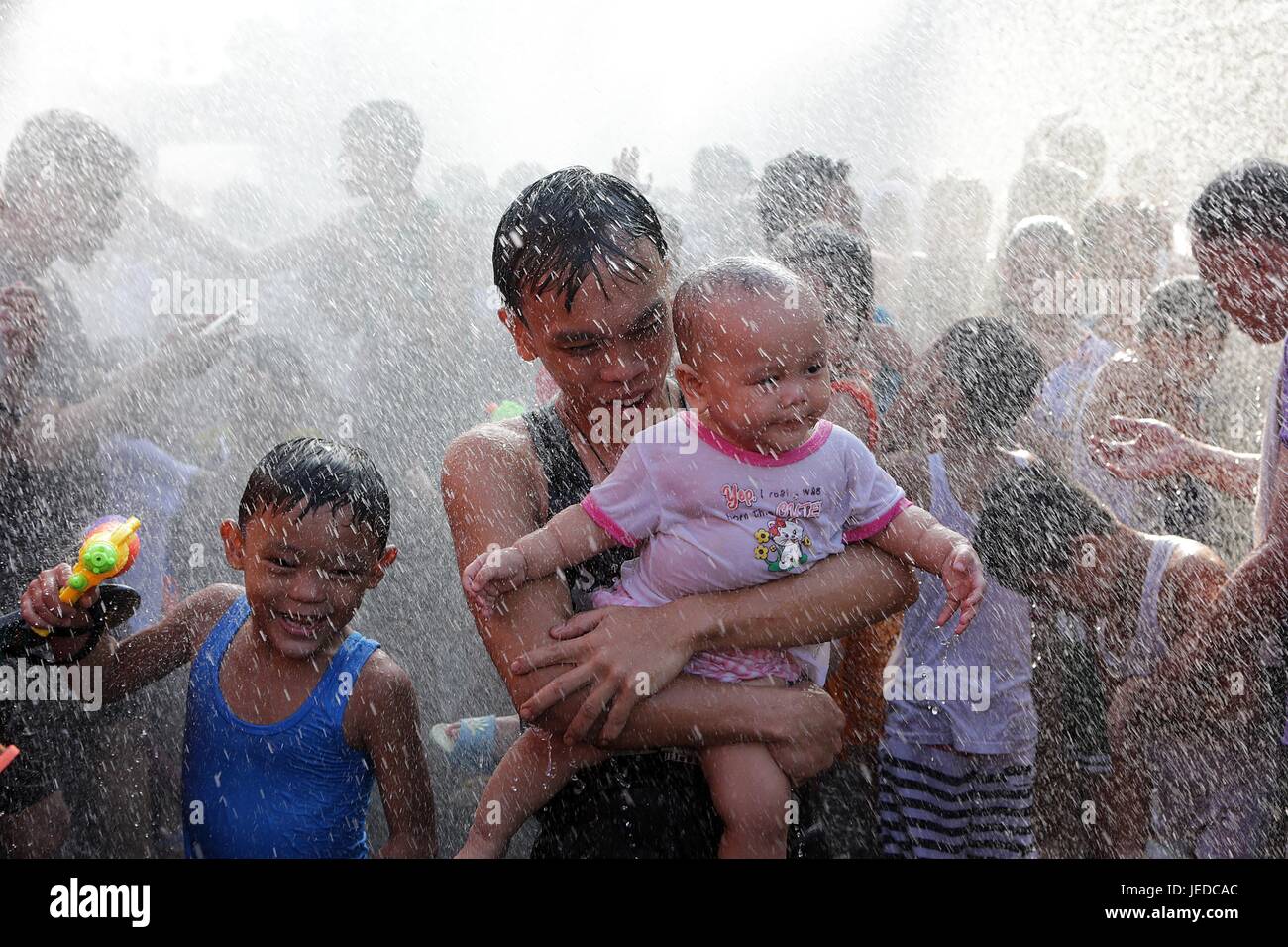 San Juan City, Philippines. 24th June, 2017. Revelers are sprayed with ...
