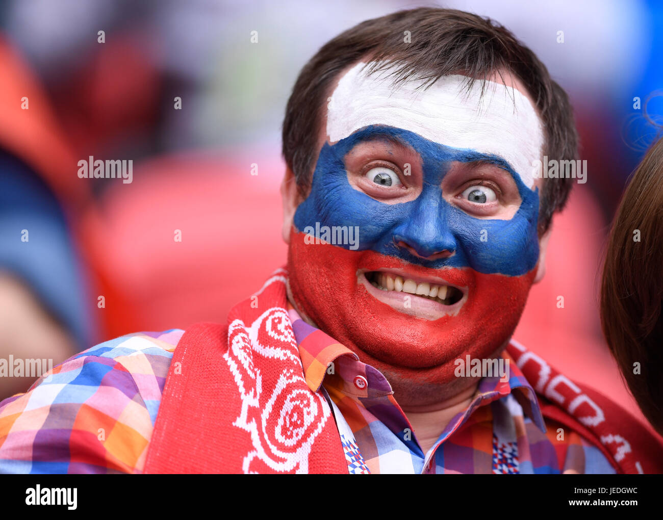 Kazan, Russia. 24th June, 2017. A Russian fan waits for kick-off before ...