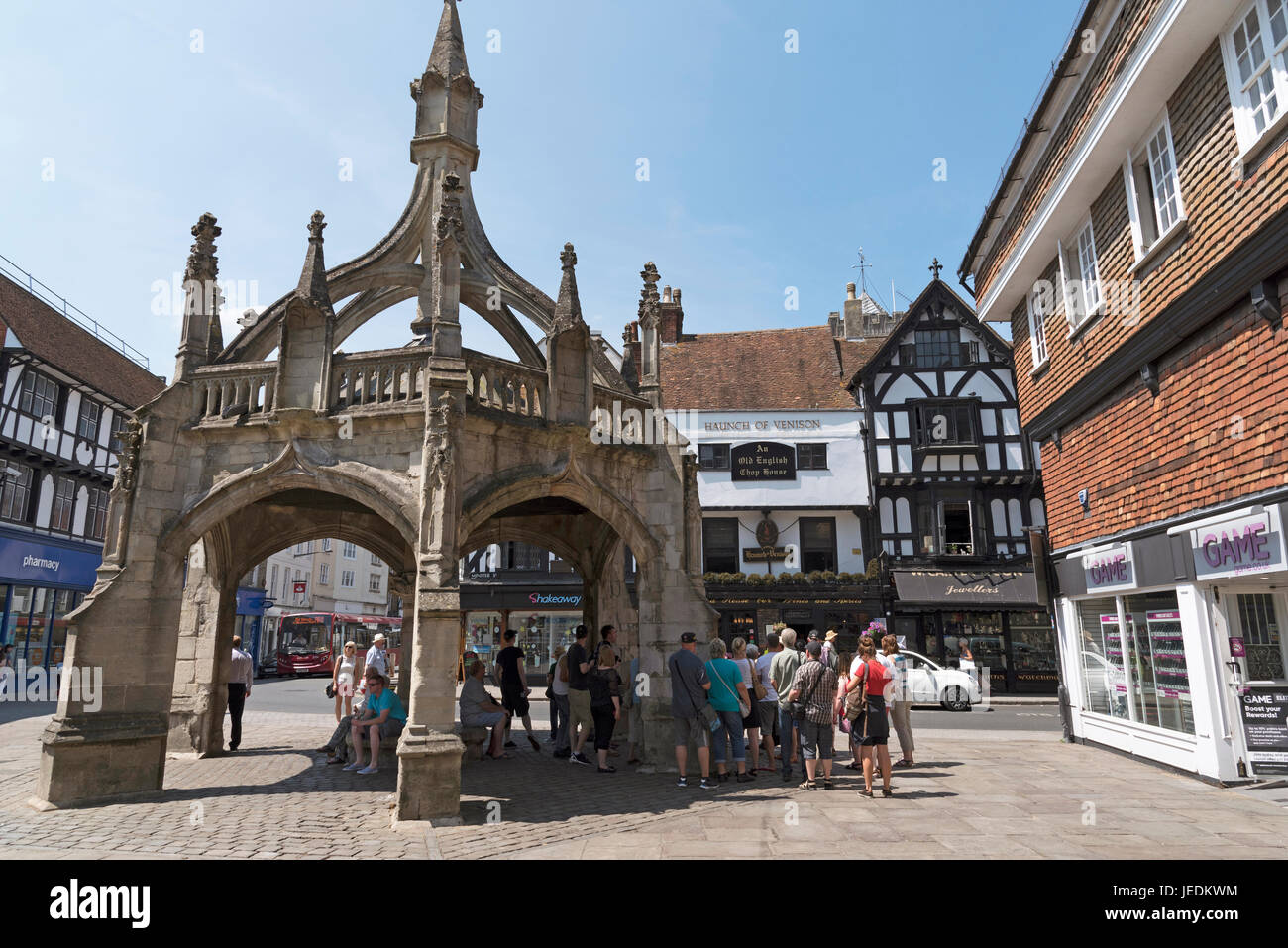 Tourists on tour looking at the famous Haunch of Venison pub opposite ...