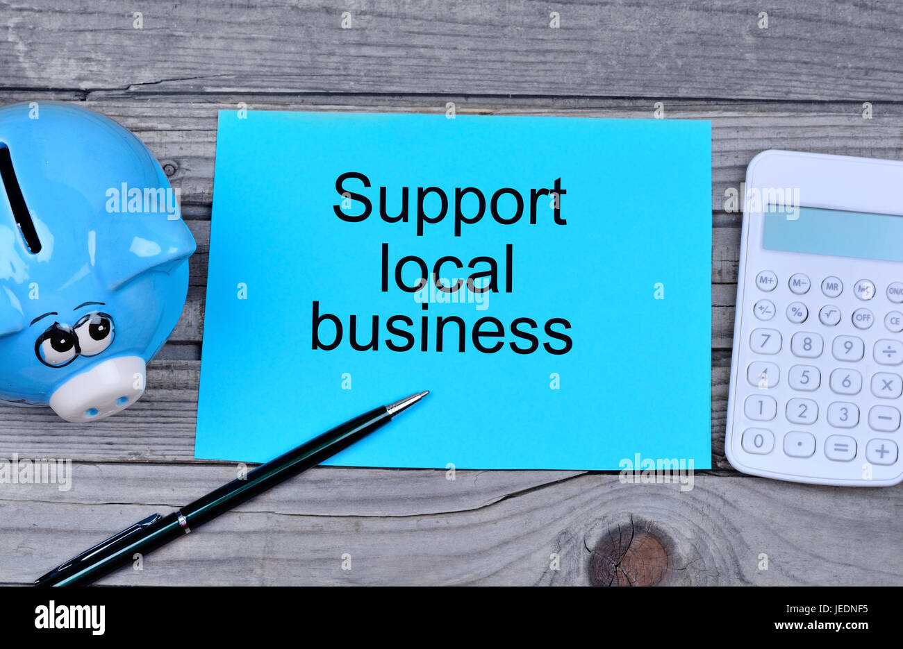 Support local business on blue paper Stock Photo - Alamy