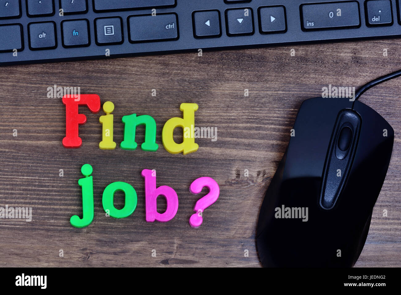 Question Find job on wooden table Stock Photo - Alamy